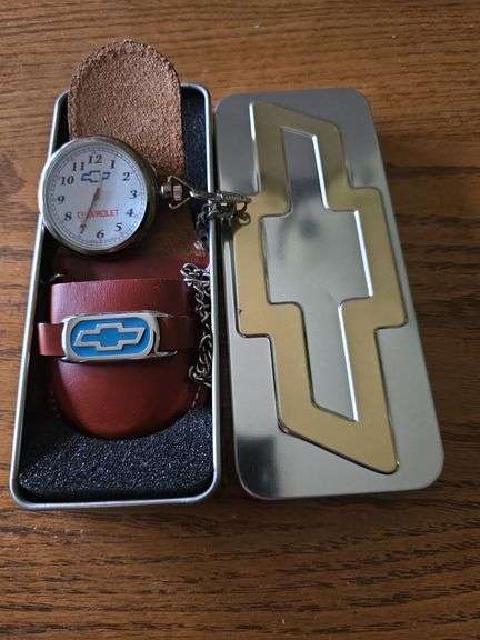 CHEVROLET WATCH WITH POUCH AND TIN - Kaufman Realty & Auctions
