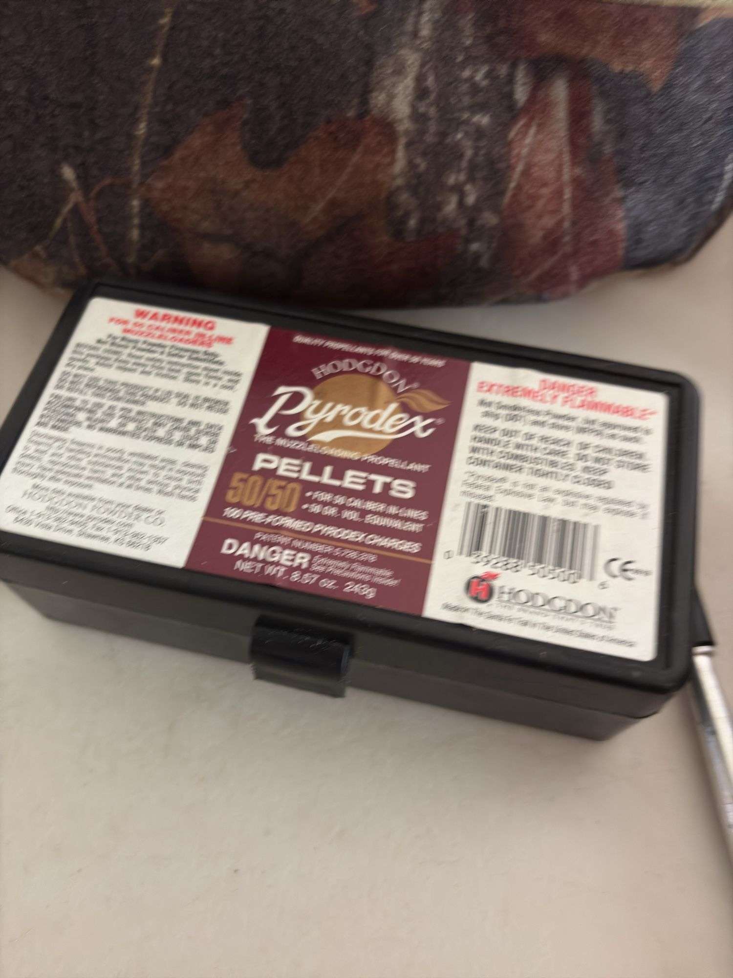 Box of muzzleloading supplies, camo fanny, pack, powder, and more ...