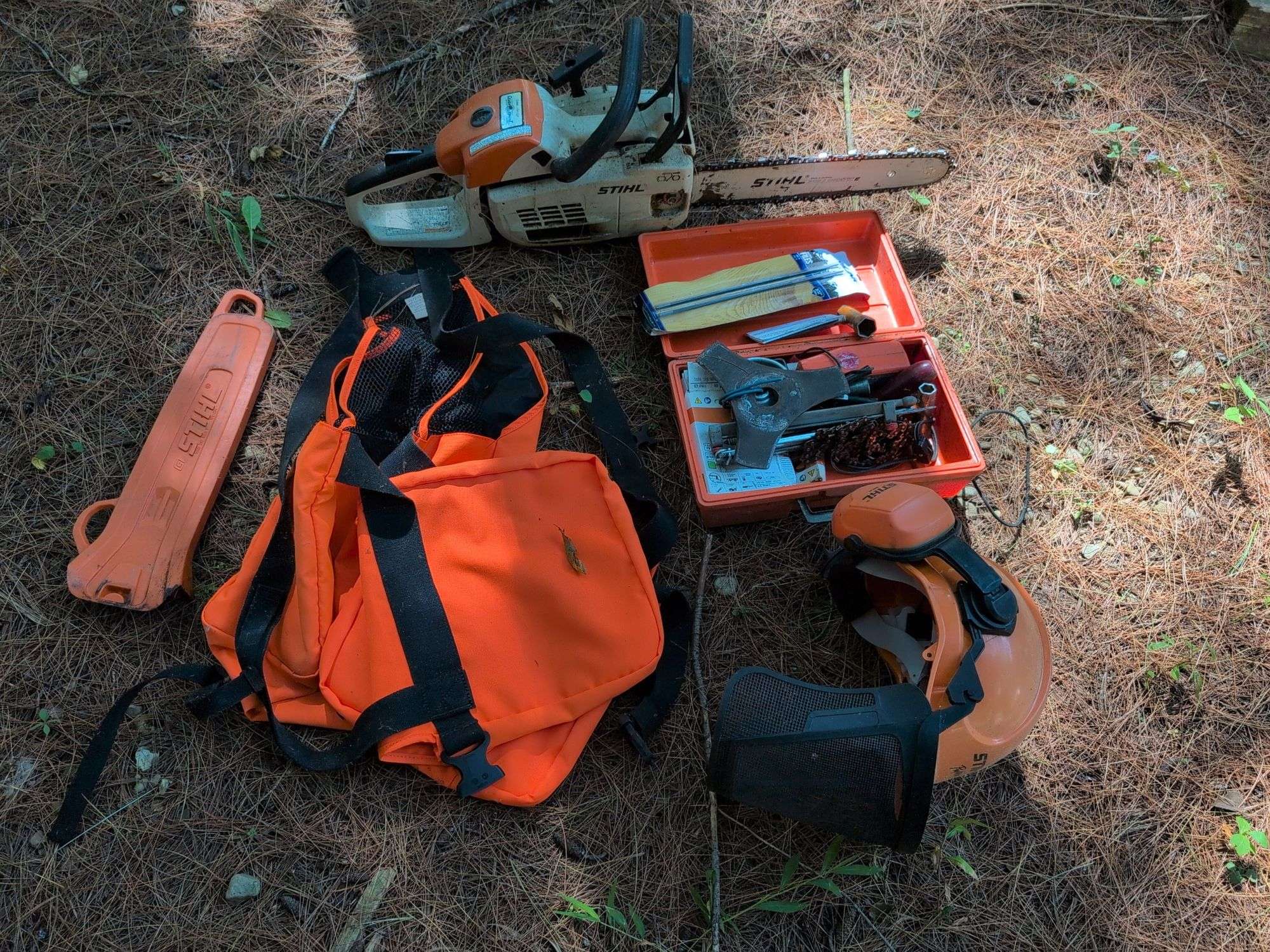 Stihl MS 201C chainsaw, protective helmet, and extra chains - Kaufman ...