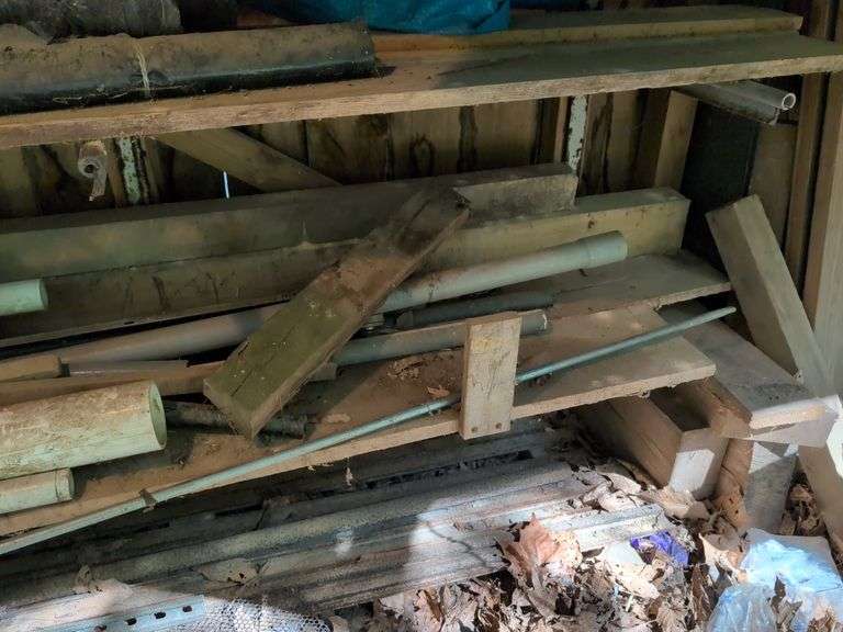 Contents of shelves - lumber, PVC piping, metal piping, tarps, and more ...