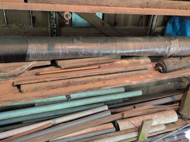 Contents of shelves - lumber, PVC piping, metal piping, tarps, and more ...