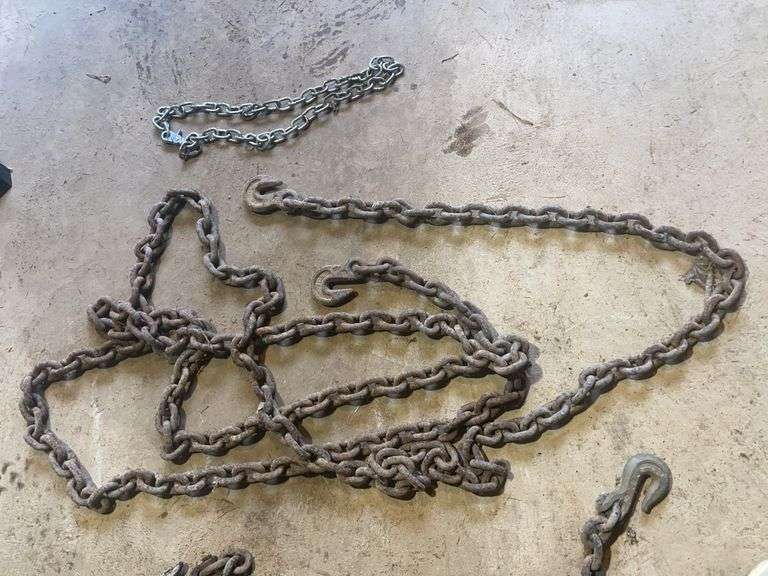 Winch hoist with (2) double hook larger rusty chains and (2) small ...