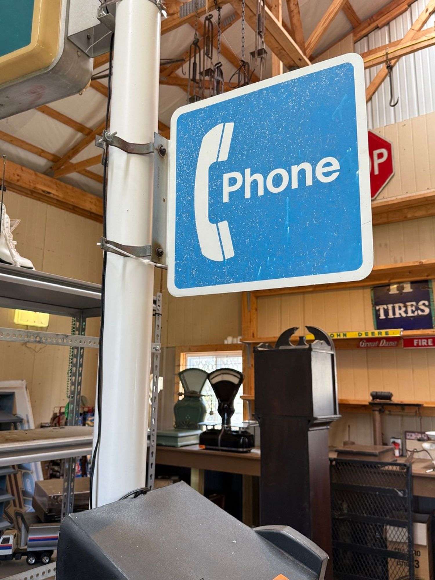 VINTAGE PHONE BOOTH WITH SIGNS ON POLE - Kaufman Realty & Auctions